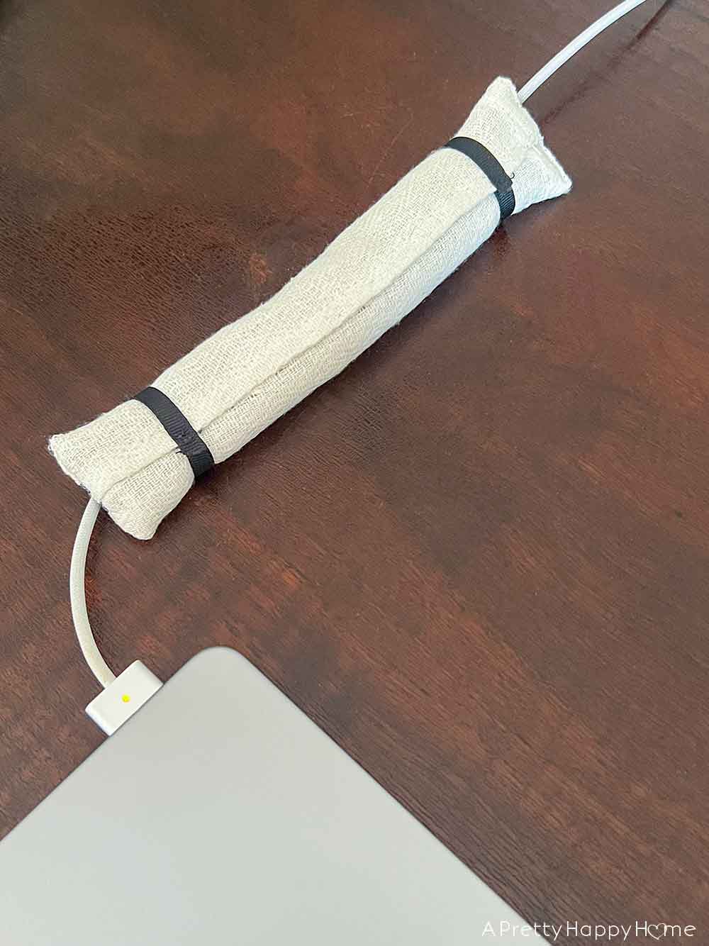 DIY Weighted Cord Holder Using Fabric and Rice – A Pretty Happy Home